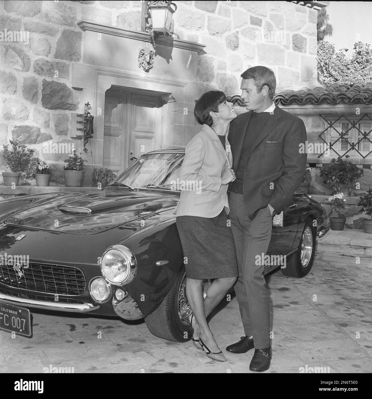 Film and TV star Steve McQueen and his wife Neile stand by his sports ...