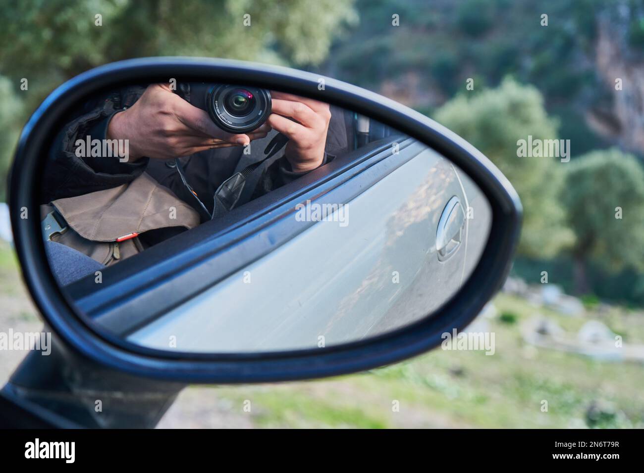 Camera reflected in a mirror of car Stock Photo - Alamy
