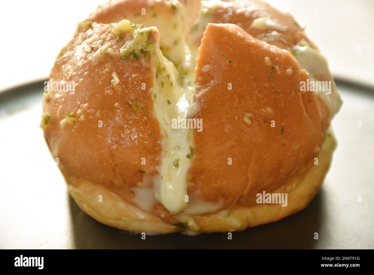 bread bun stuffed garlic cheese sauce arranging on plate Stock Photo ...