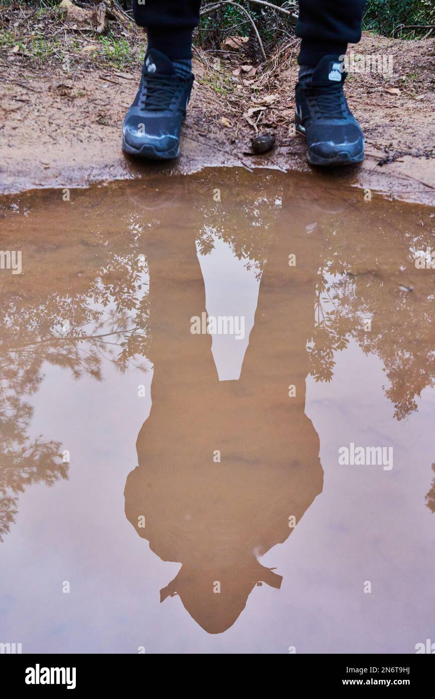 A reflection of a man in water Stock Photo - Alamy