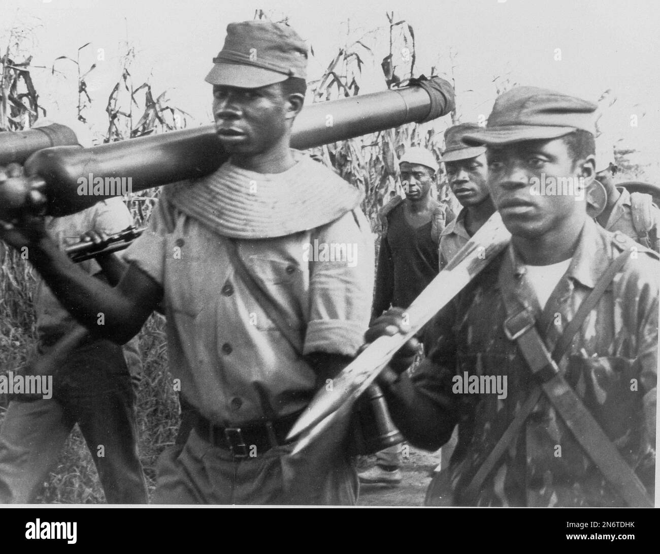 A Frelimo artillery unit carrying mortar in the Portuguese East African ...