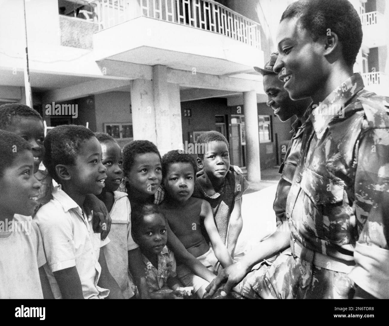 Soldiers of the Mozambique Liberation Front (FRELIMO) talk to children ...