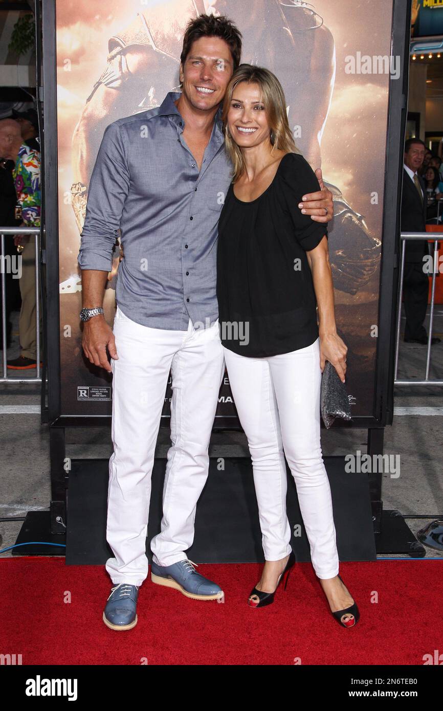 From left, actor Michael Trucco and wife / actress Sandra Hess arrive ...