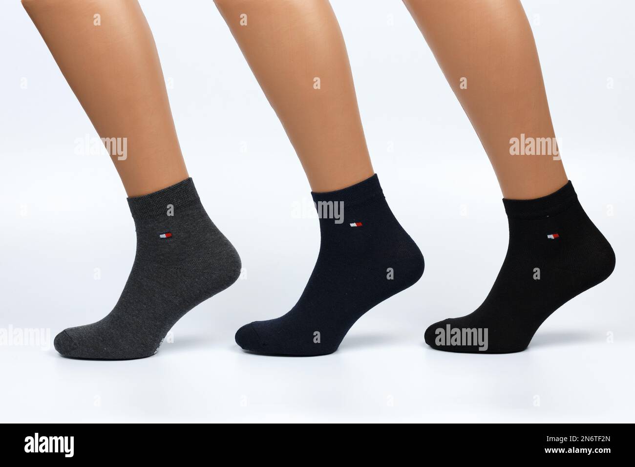 Socks on the leg. Socks on a white background Stock Photo - Alamy