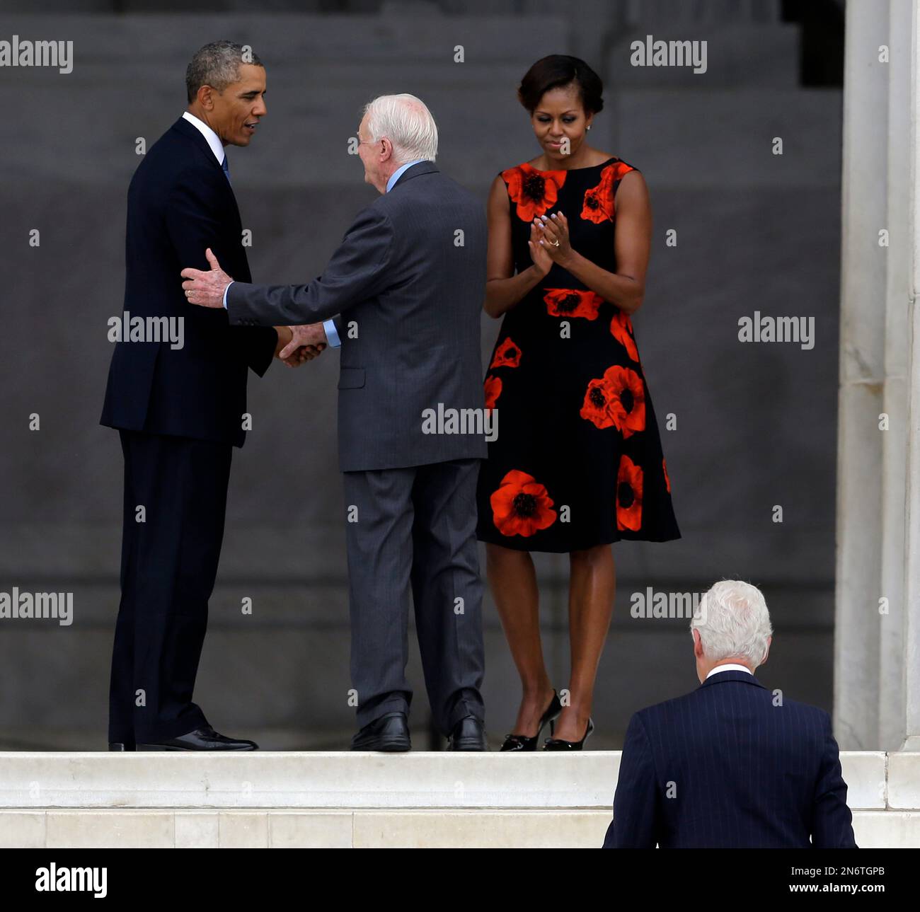 President Barack Obama shakes hands with former President Jimmy Carter ...