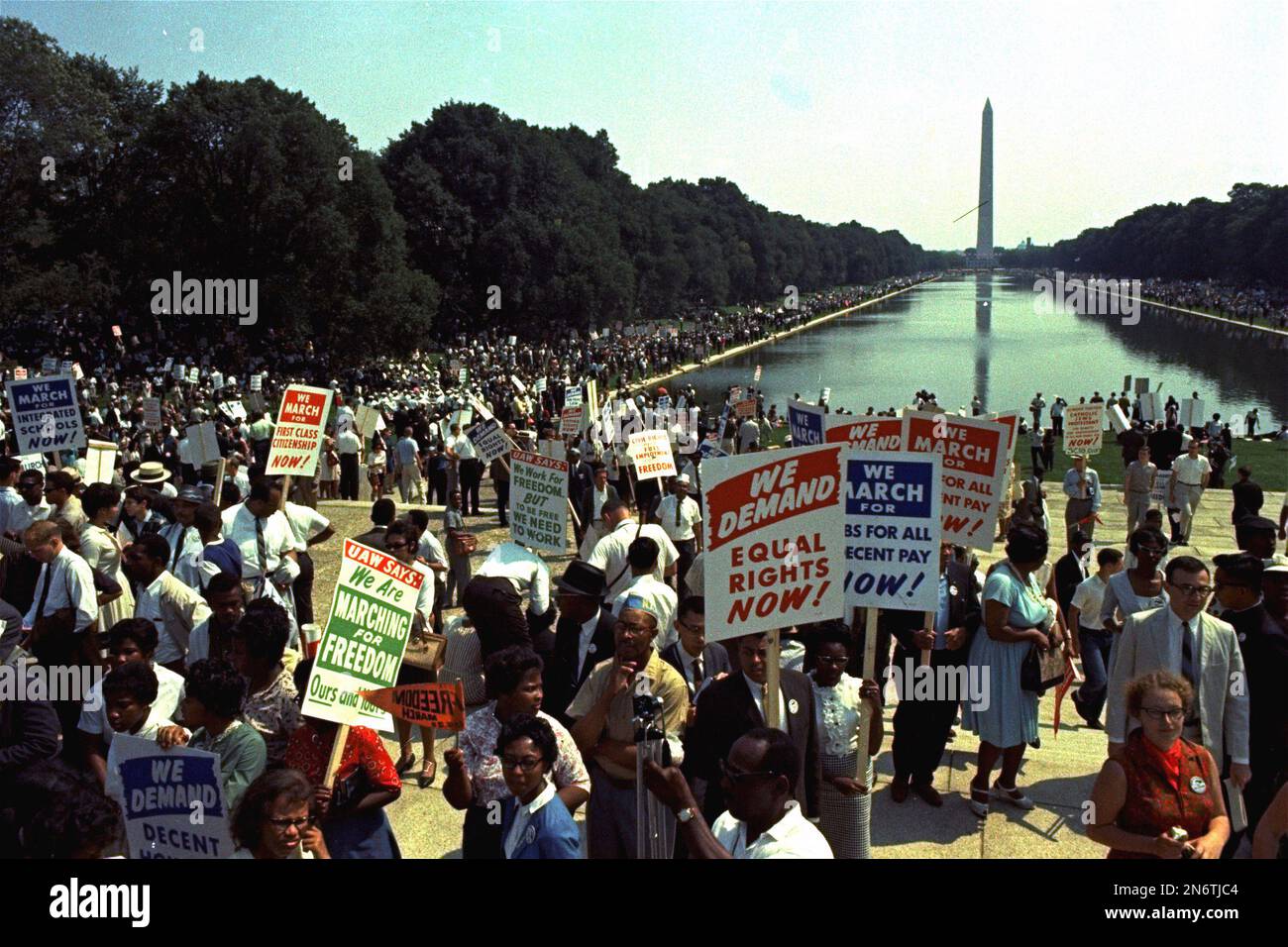 People carry civil rights signs as they gather in Washington, D.C ...
