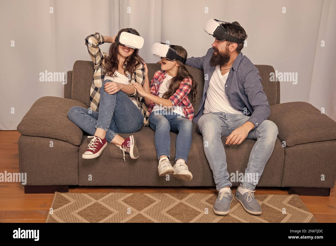 happy parents with kid girl use modern technology. mom dad and daughter ...