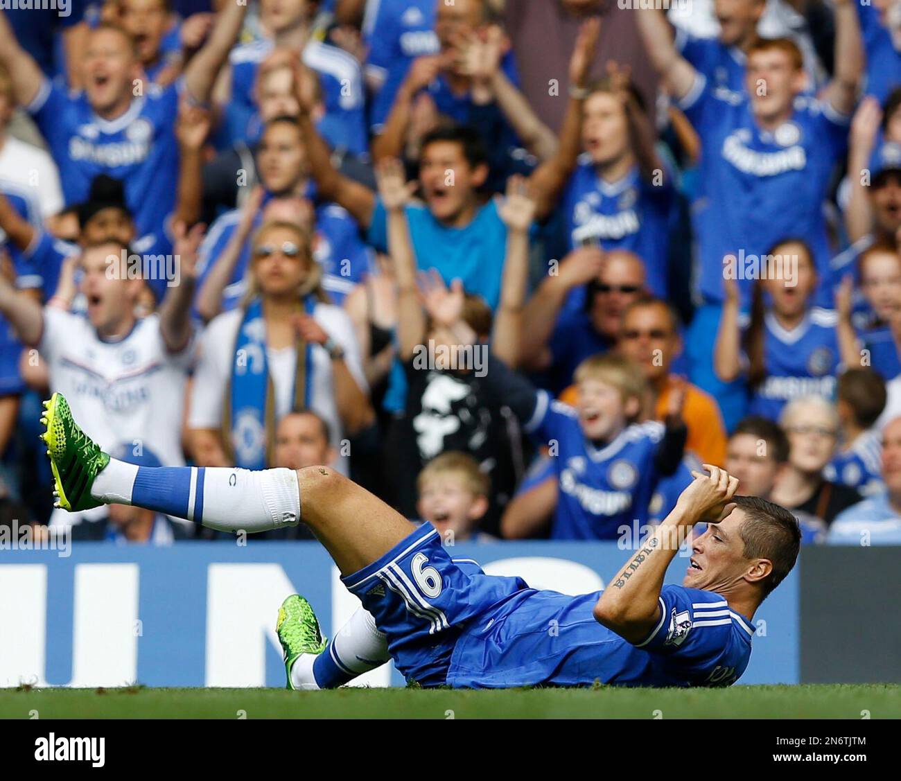 Chelsea's Fernando Torres falls during the English Premier League ...