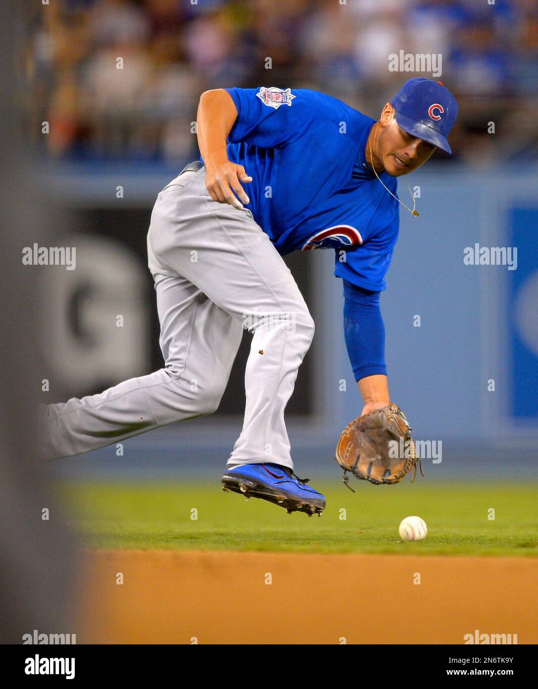 Chicago Cubs second baseman Darwin Barney can't reach a ball hit for a ...