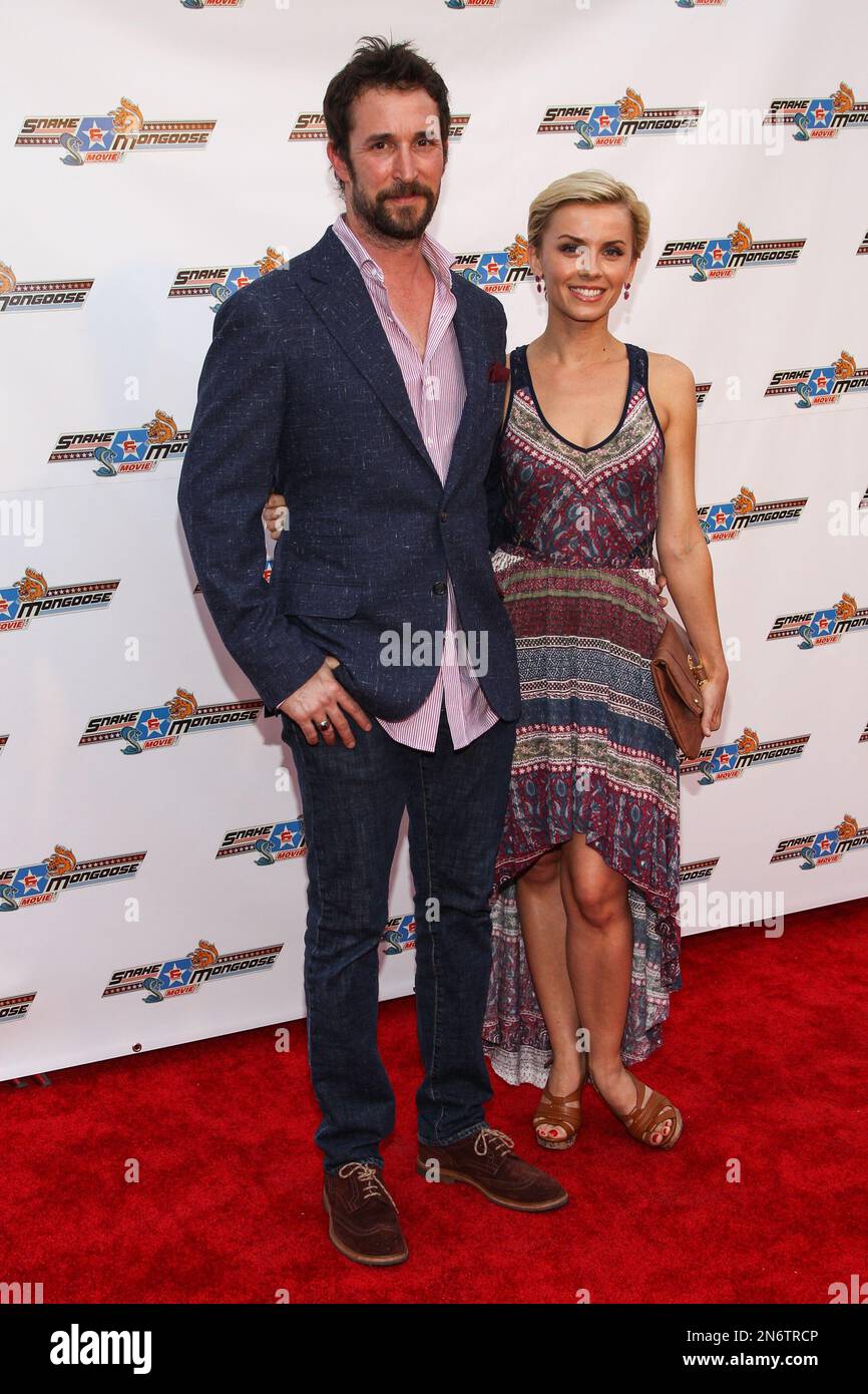 From left, actors Noah Wyle and Sara Wells arrive at the premiere of ...