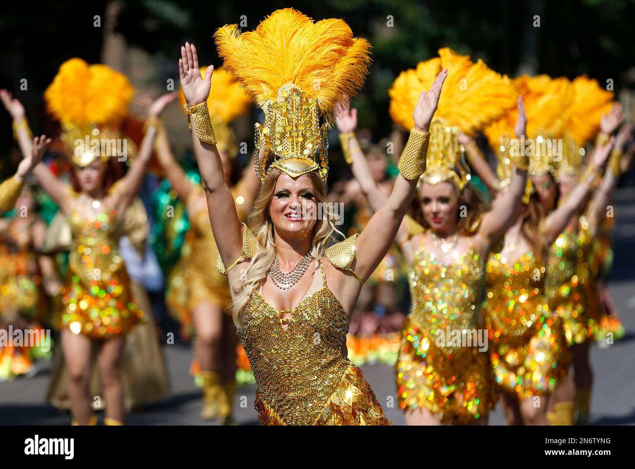 Revellers dance as they parade through the streets during the Notting ...