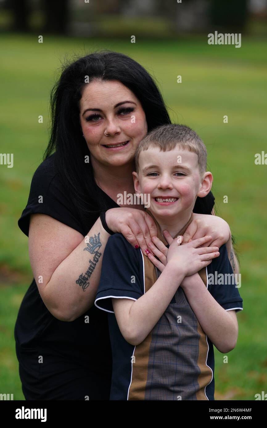 Four-year-old Hanlon Stevenson with his mother Lisa after he received a ...