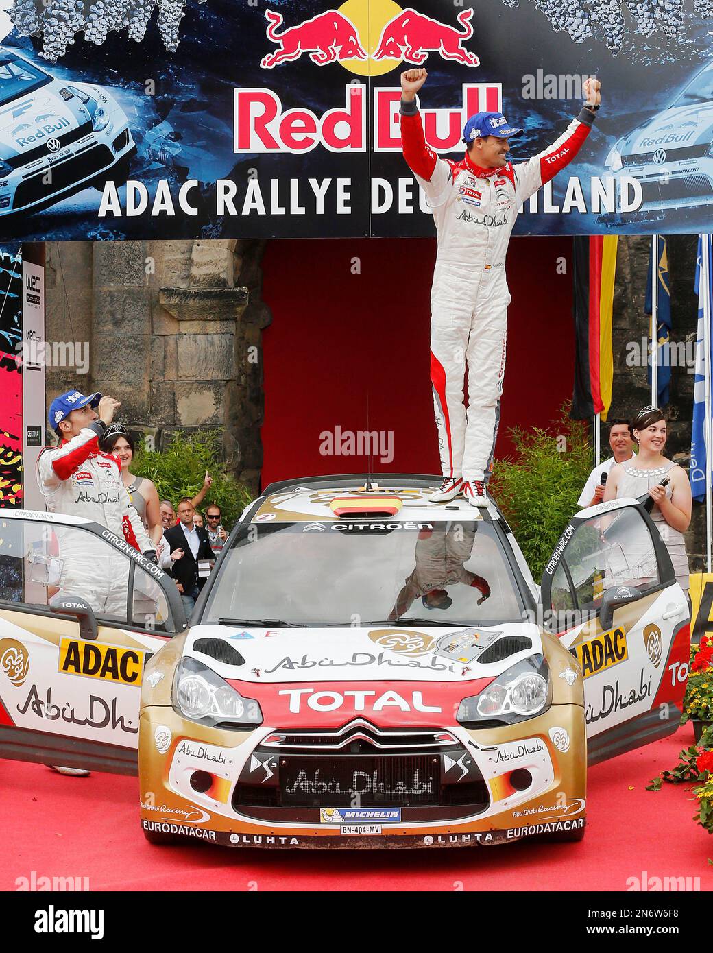 Spain's rallye driver Daniel Sordo stands on top of his Citroen after ...