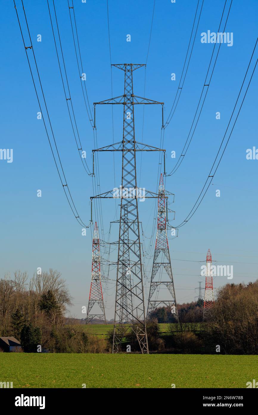 High voltage power lines in the countryside Stock Photo - Alamy