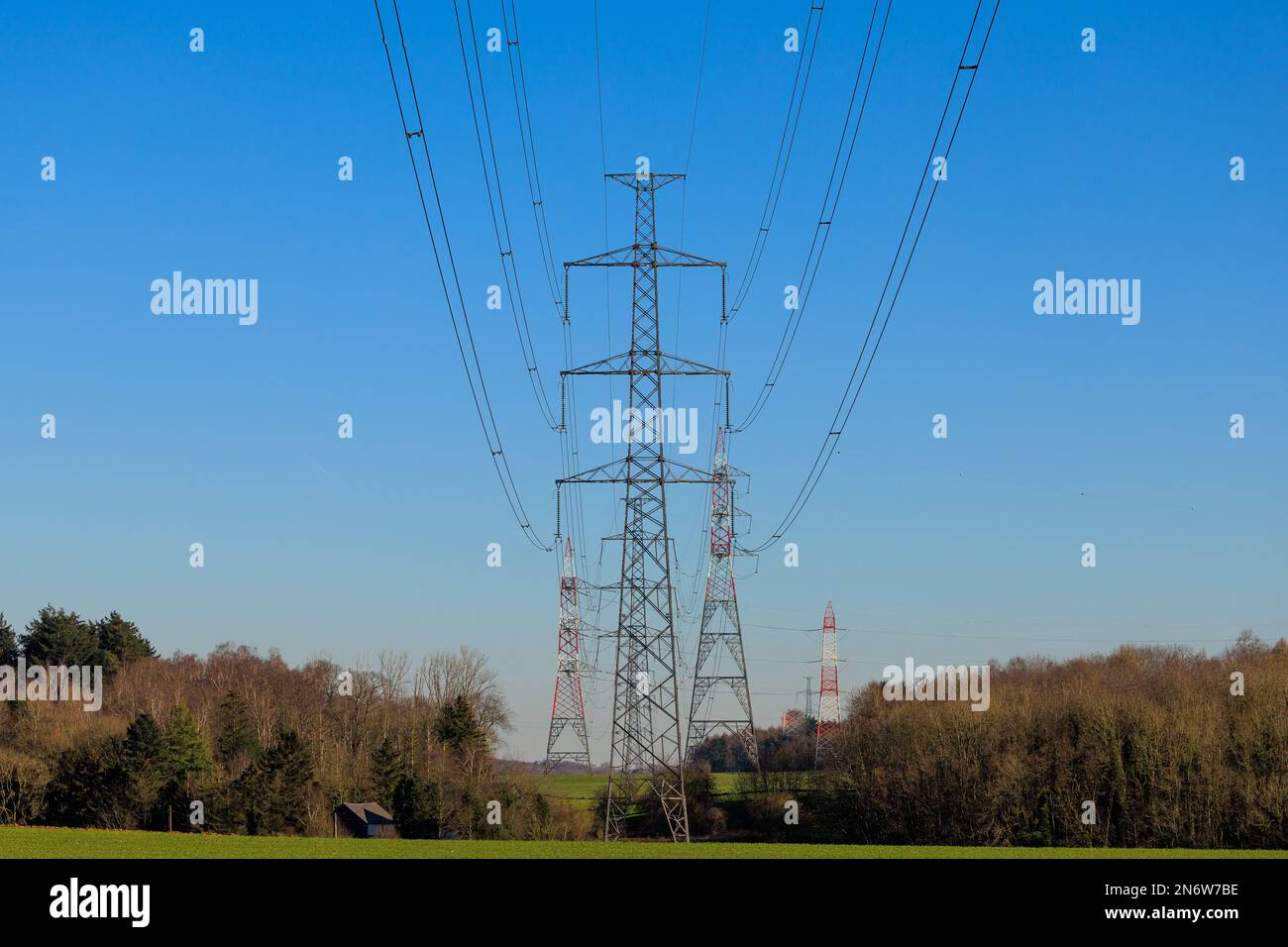 High voltage power lines in the countryside Stock Photo - Alamy