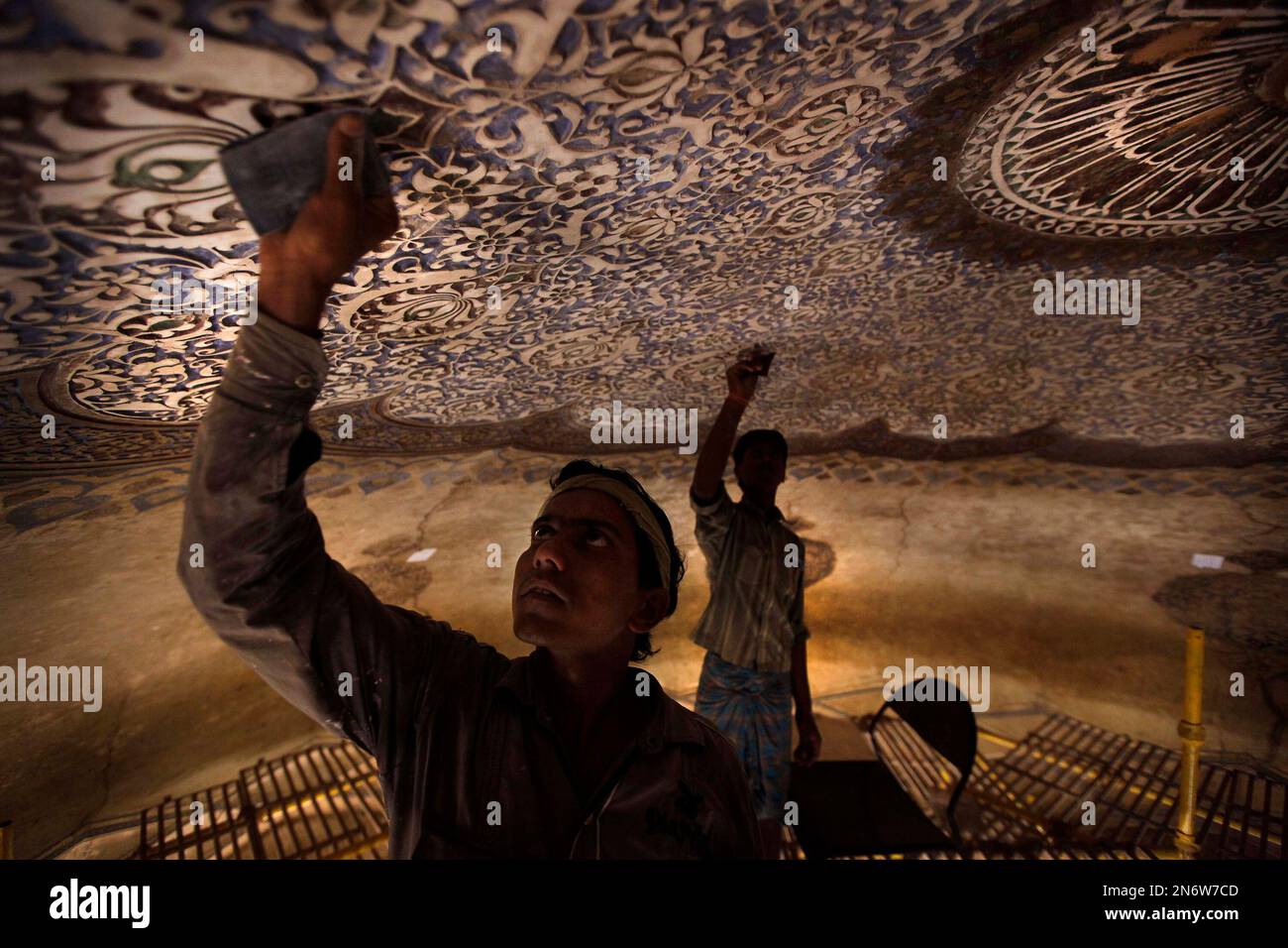 In this Friday, June 7, 2013 photo, Indian laborers work to renovate ...