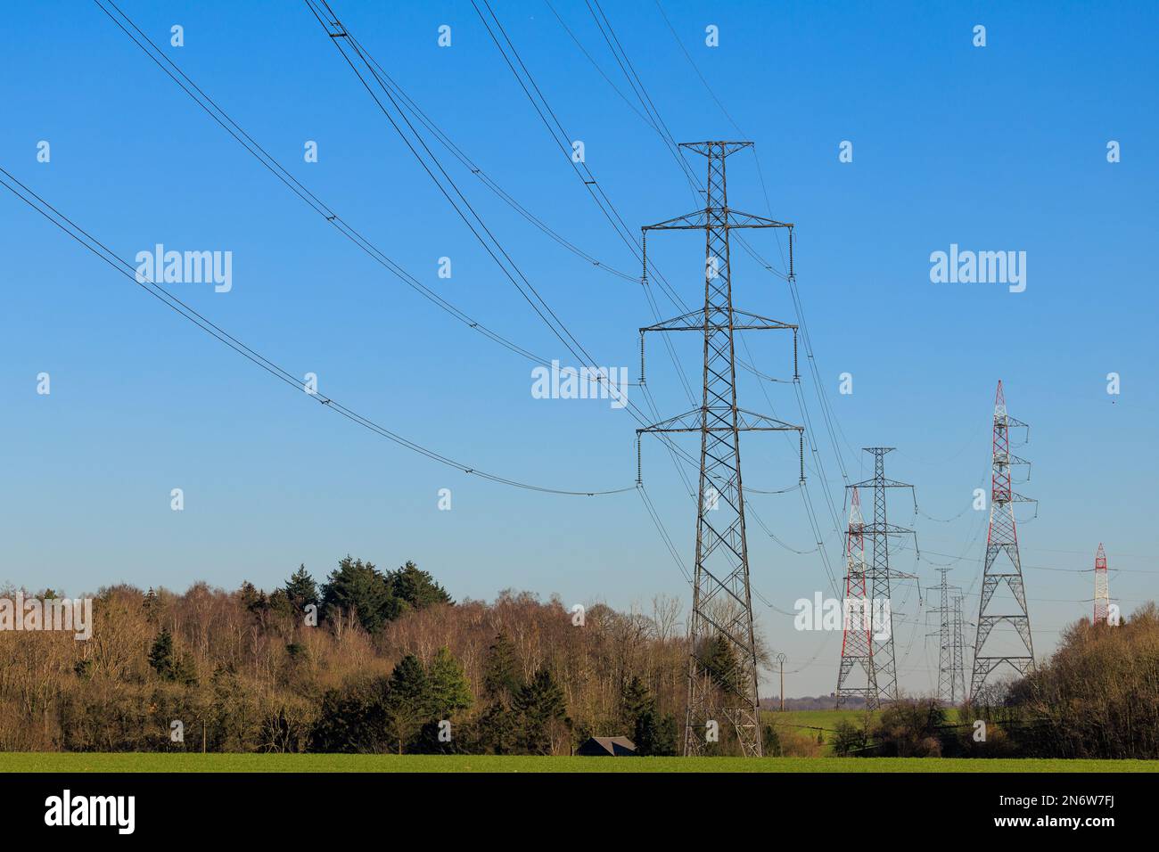 High voltage power lines in the countryside Stock Photo - Alamy