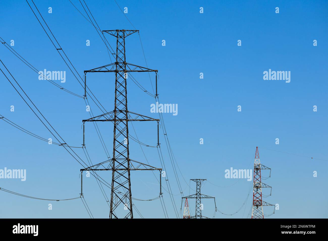 High voltage power lines in the countryside Stock Photo - Alamy