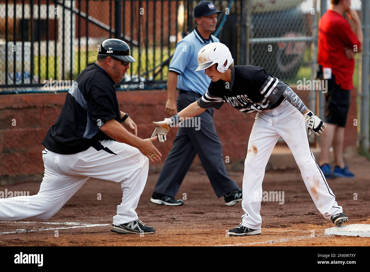 Houston Banditos coach Ray De Leon high fives player Tyler Kehoe after ...