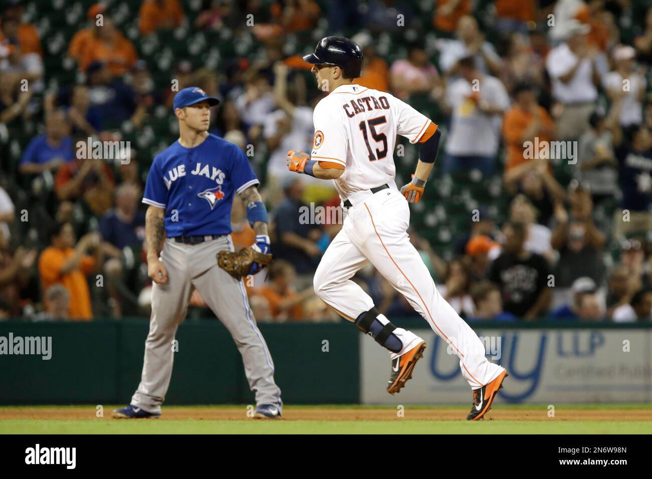 Houston Astros' Jason Castro (15) rounds the bases in front of Toronto ...
