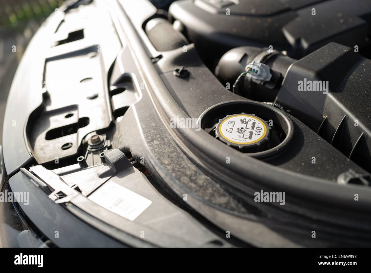 Shallow focus a a Land Rover Discovery's washer filler cap seen mounted ...