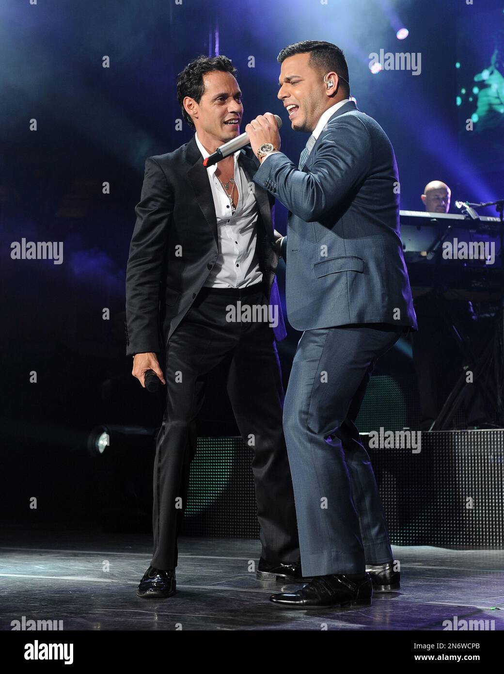 Marc Anthony and Tito El Bambino perform on opening night of the “Vivir ...