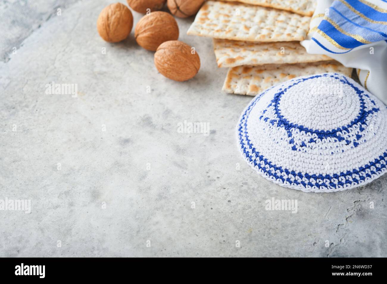 Passover celebration concept. Matzah, red kosher and walnut. Traditional ritual Jewish bread ...