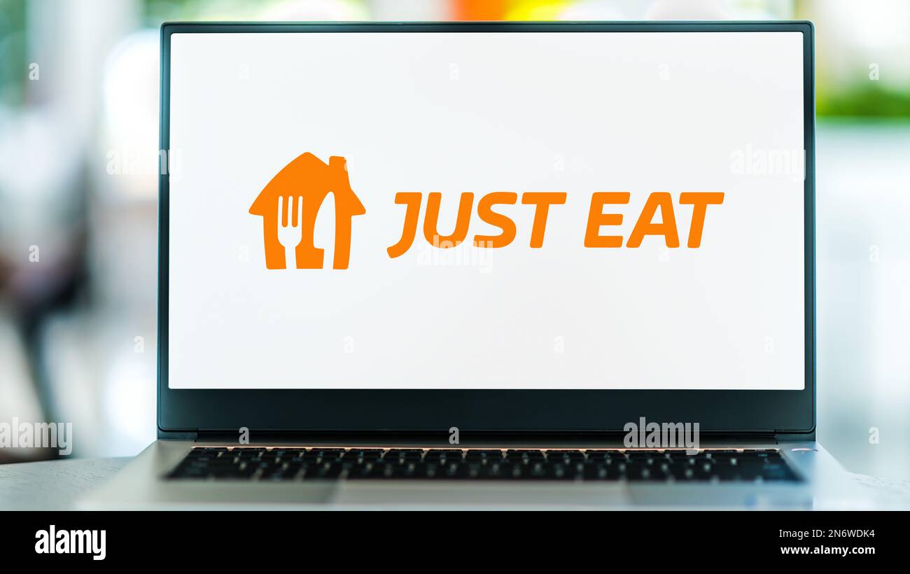 POZNAN, POL - NOV 22, 2022: Laptop computer displaying logo of Just Eat ...