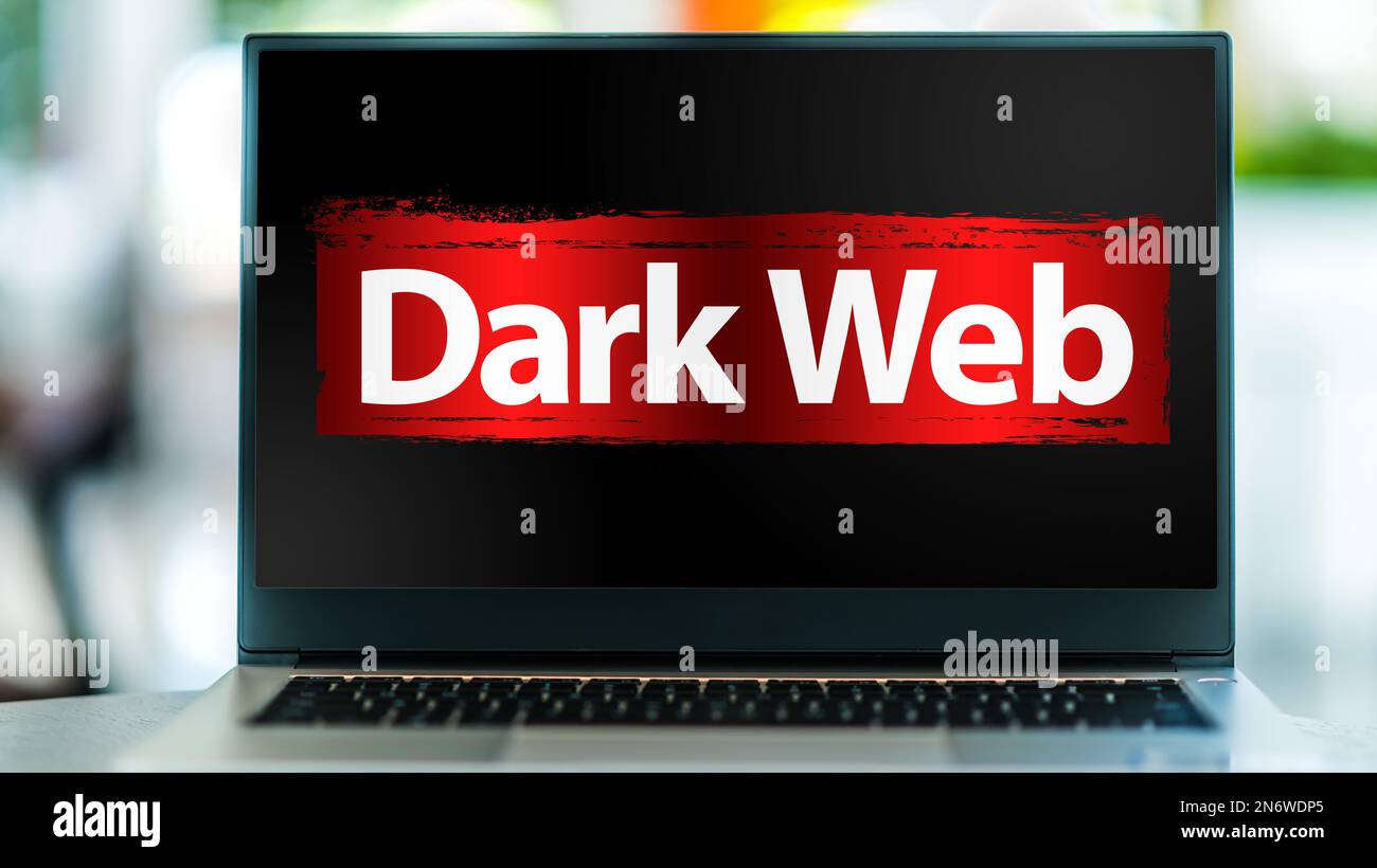 Laptop computer displaying the warning sign of the dark web Stock Photo ...