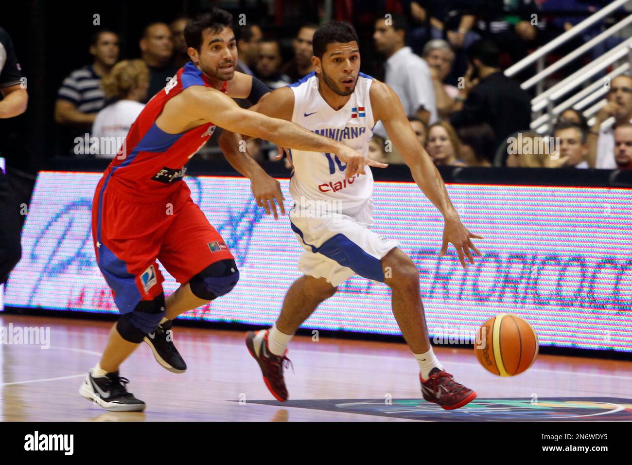 Puerto Rico’s Andres Rodriguez, left, pressures Dominican Republic’s ...