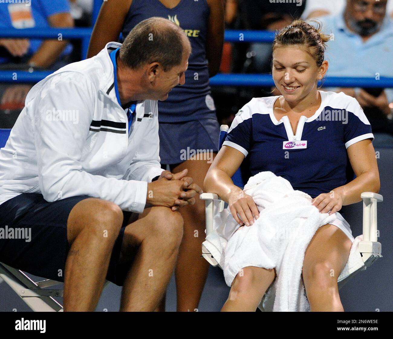 Simona Halep, of Romania, speaks with her coach during her 6-2, 7-5 ...