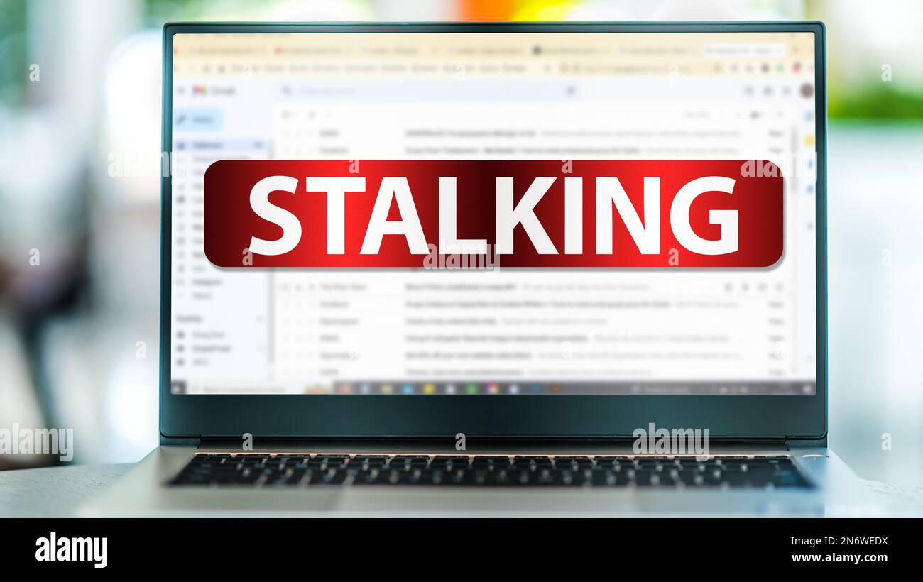 Laptop computer displaying the sign of stalking on an internet email ...