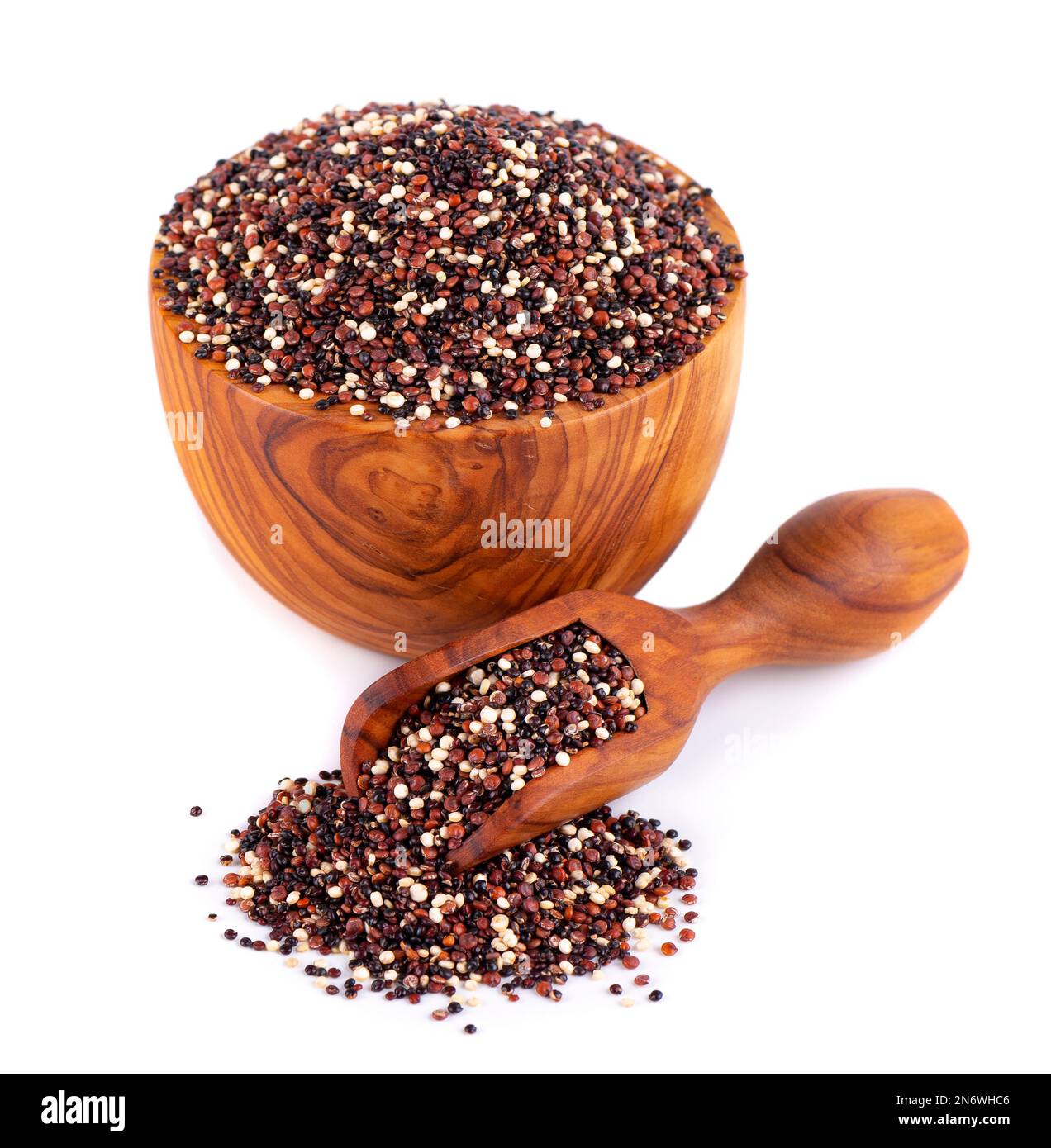 Quinoa seeds in wooden bowl and spoon, isolated on white background ...