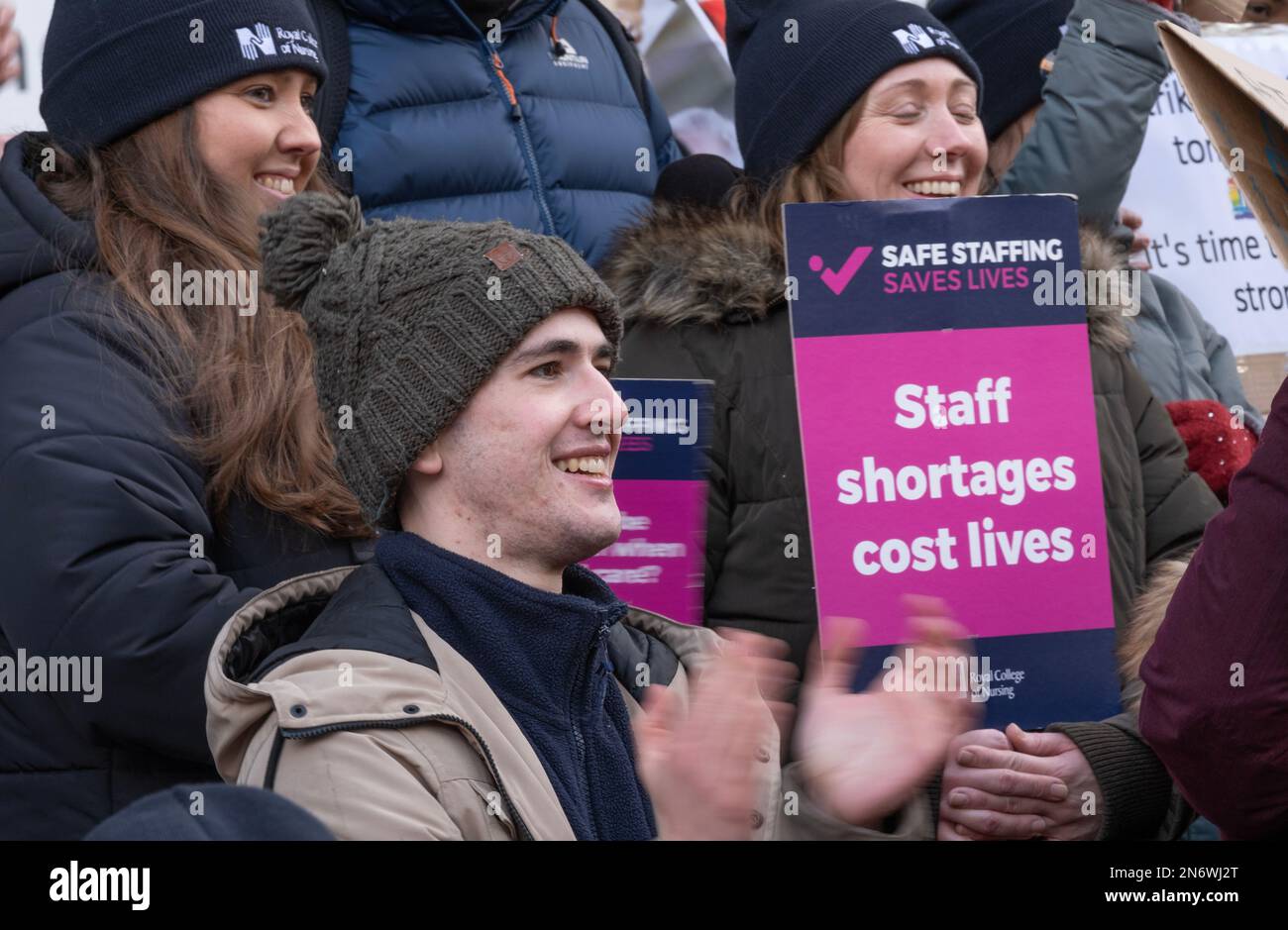 Striking nurses with placards, demonstrating outside University College ...