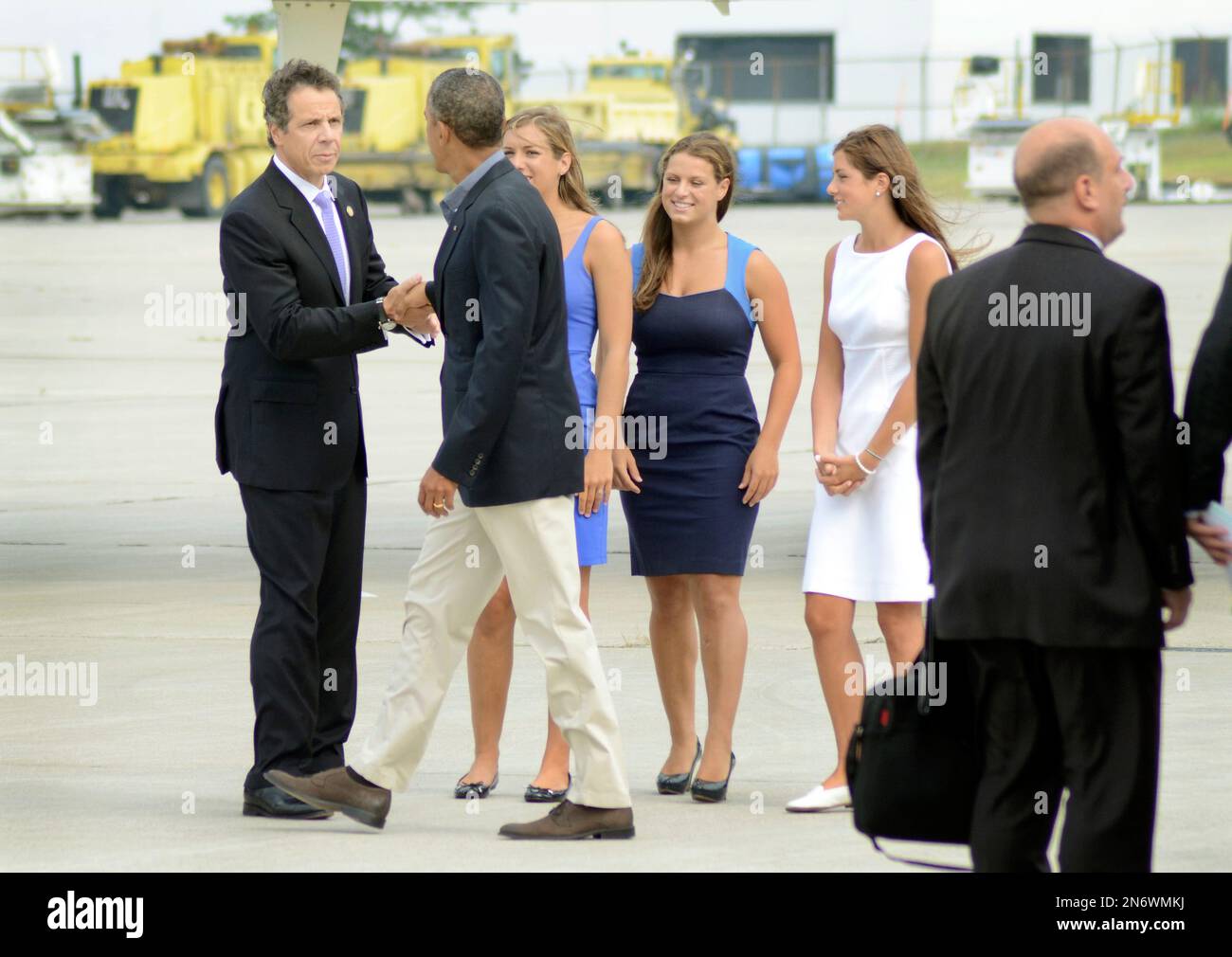 New York State Governor Andrew Cuomo, left, shakes hands with President ...