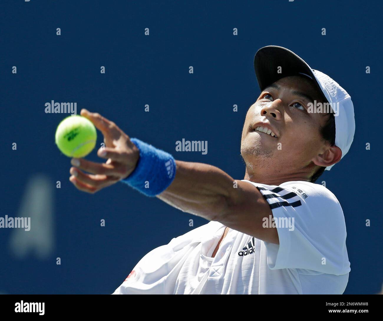 Lu Yen-Hsun, of Taiwan, tosses the ball to serve against Alexandr ...
