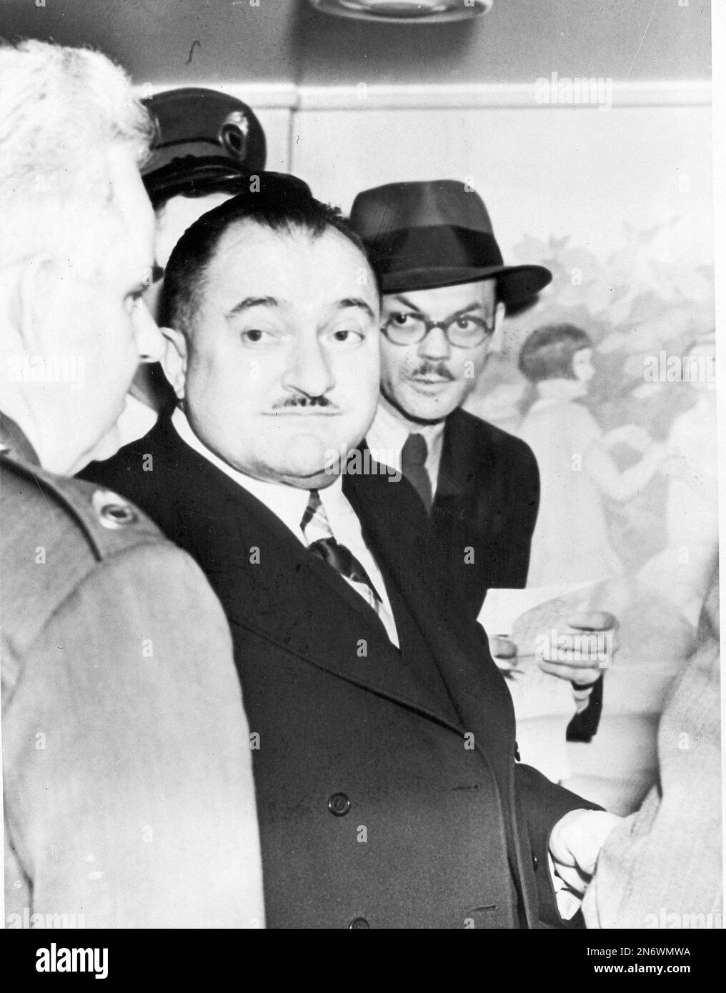 Grover Cleveland Bergdoll, center, talks to a reporter, right, as he is ...