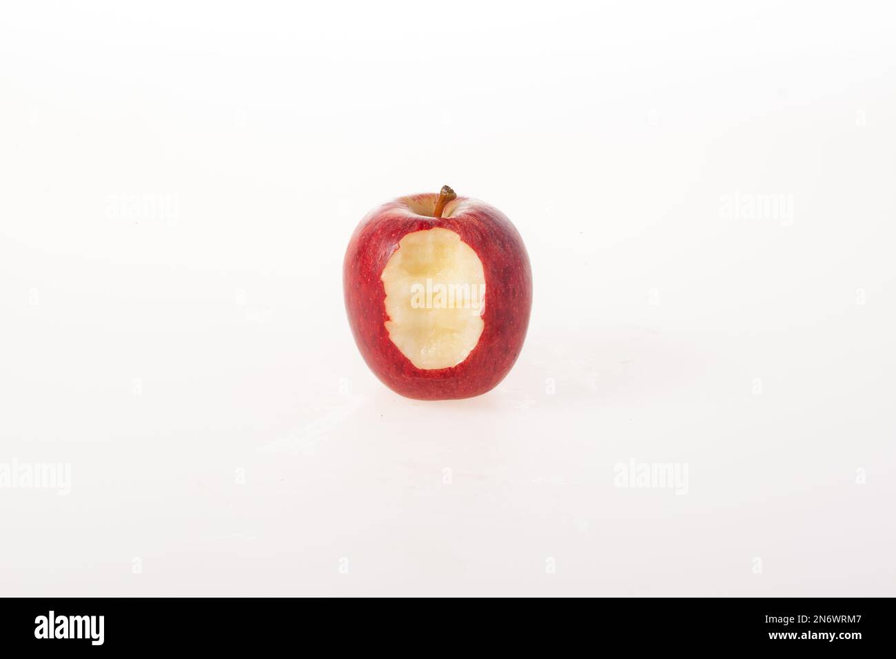 Bitten red apple isolated on white background Stock Photo - Alamy