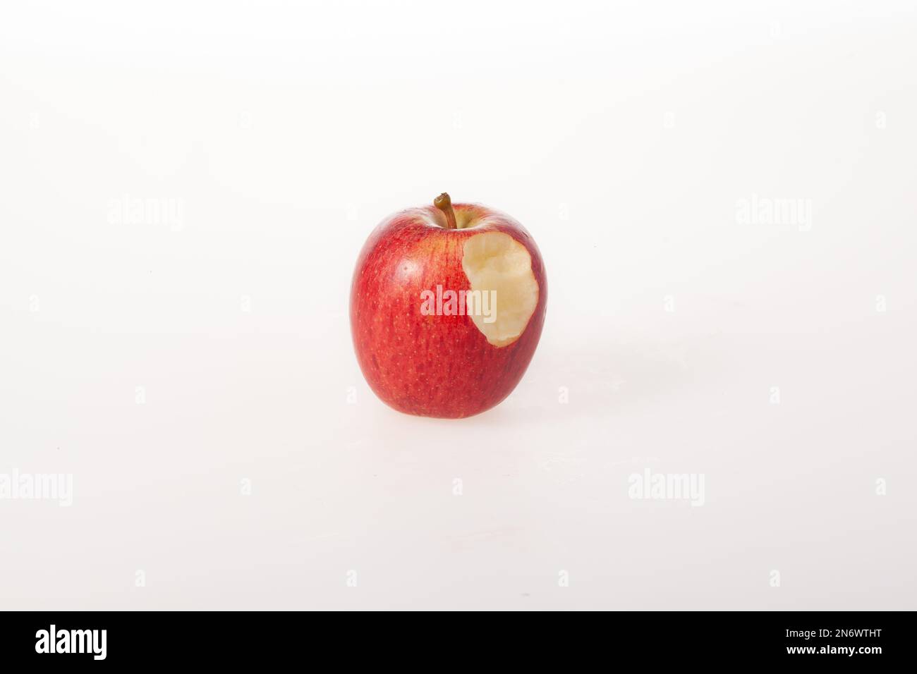 Bitten red apple isolated on white background Stock Photo - Alamy