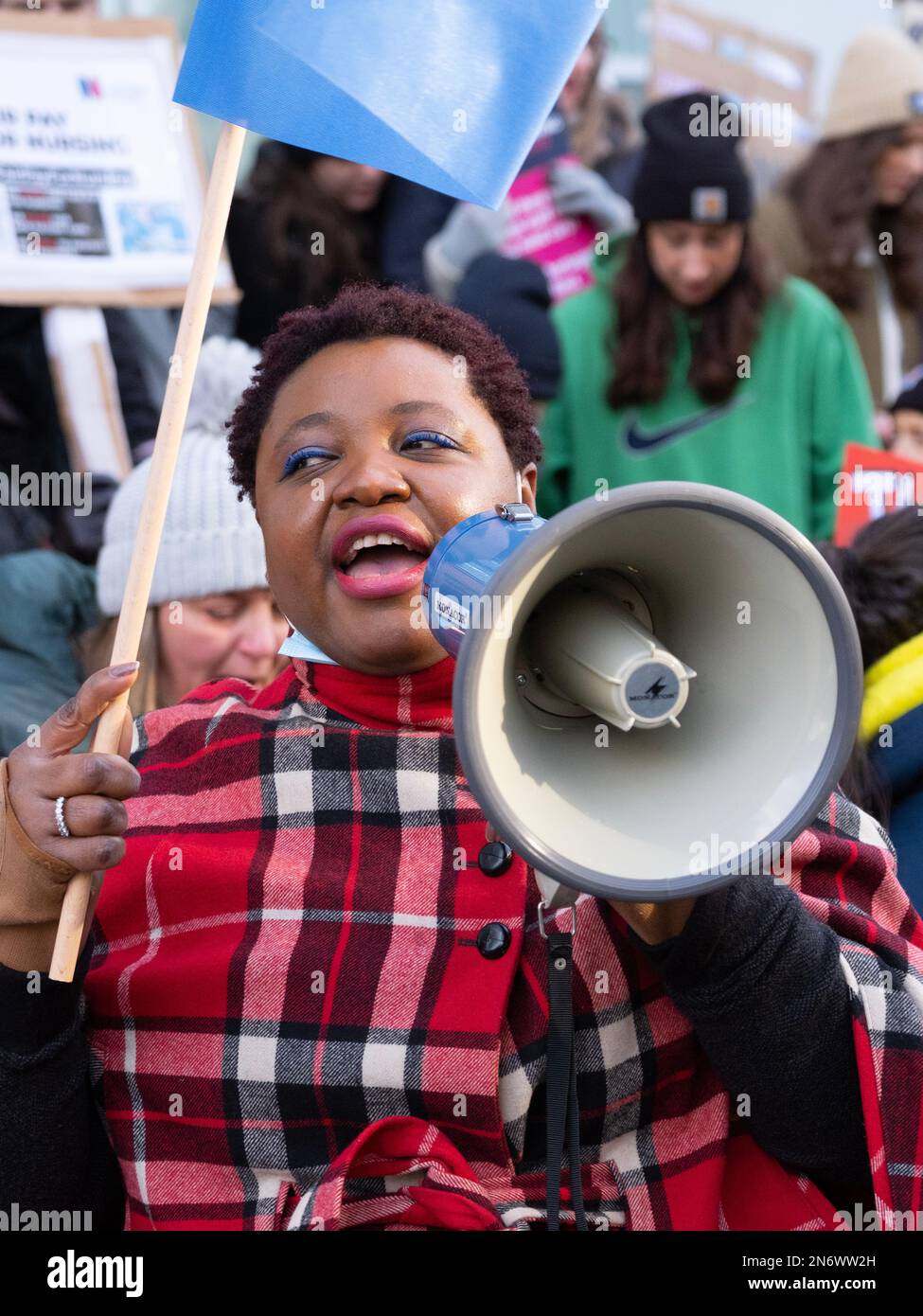Striking nurses with placards, demonstrating outside University College ...