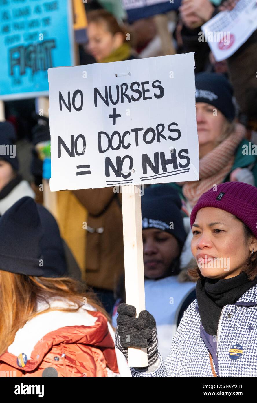 Striking nurses with placards, demonstrating outside University College ...