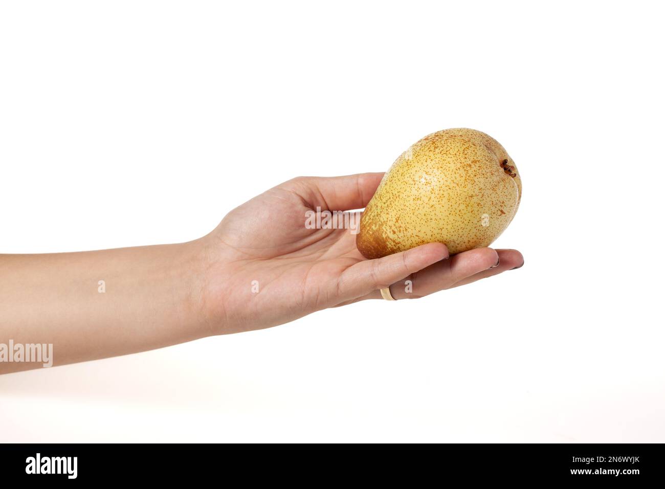 Hand holding whole pear isolated on white background Stock Photo - Alamy