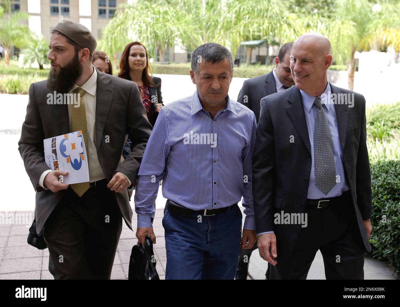 Entering the Orange County Courthouse, front row from left, Hassan ...