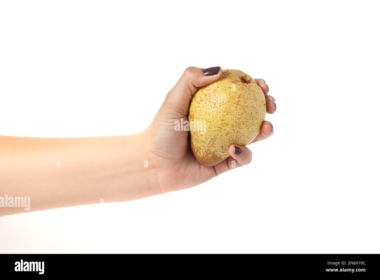 Hand holding whole pear isolated on white background Stock Photo - Alamy