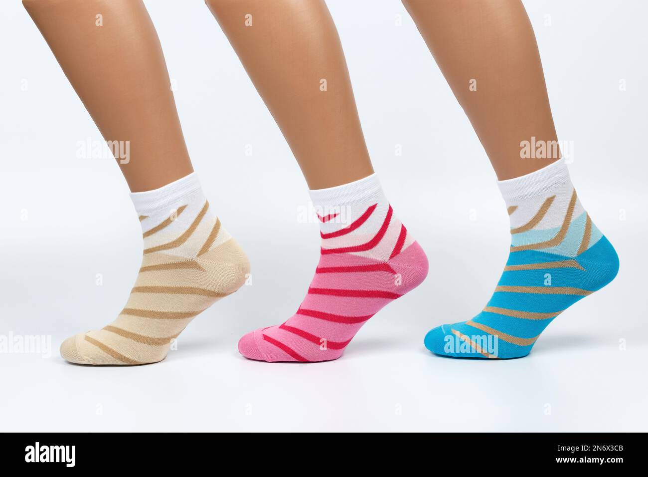 Socks on the leg. Socks on a white background Stock Photo - Alamy