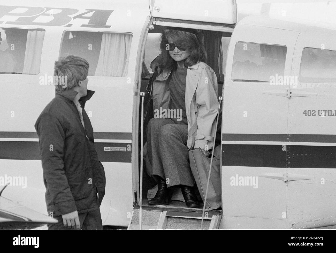 Jacqueline Kennedy Onassis, widow of President John F. Kennedy, steps ...