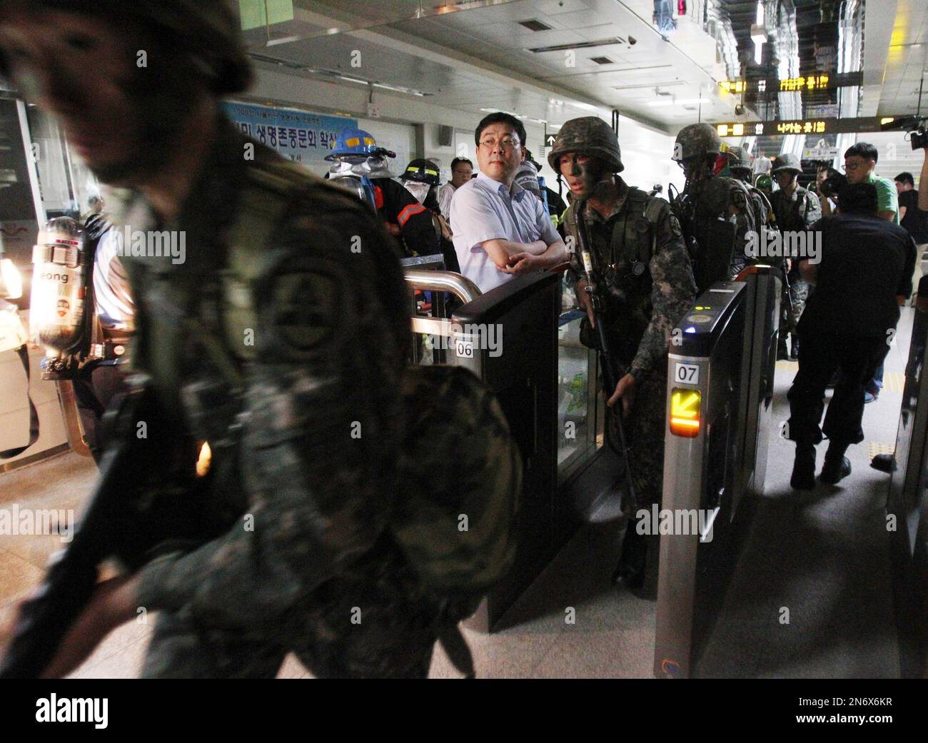 South Korean army soldiers pass by ticket gates during South Korea-U.S ...