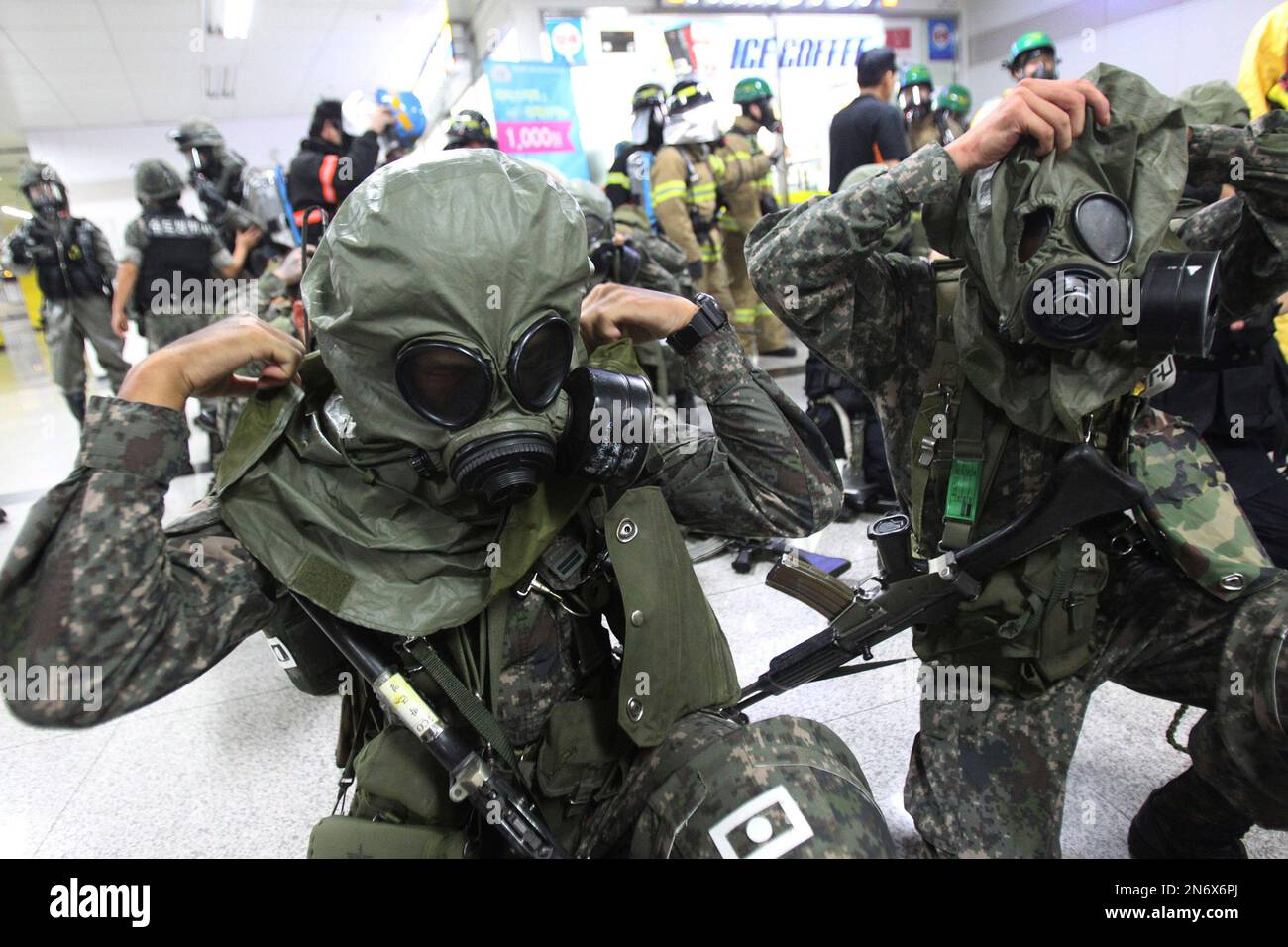 South Korean army soldiers put on gas masks during South Korea-U.S ...