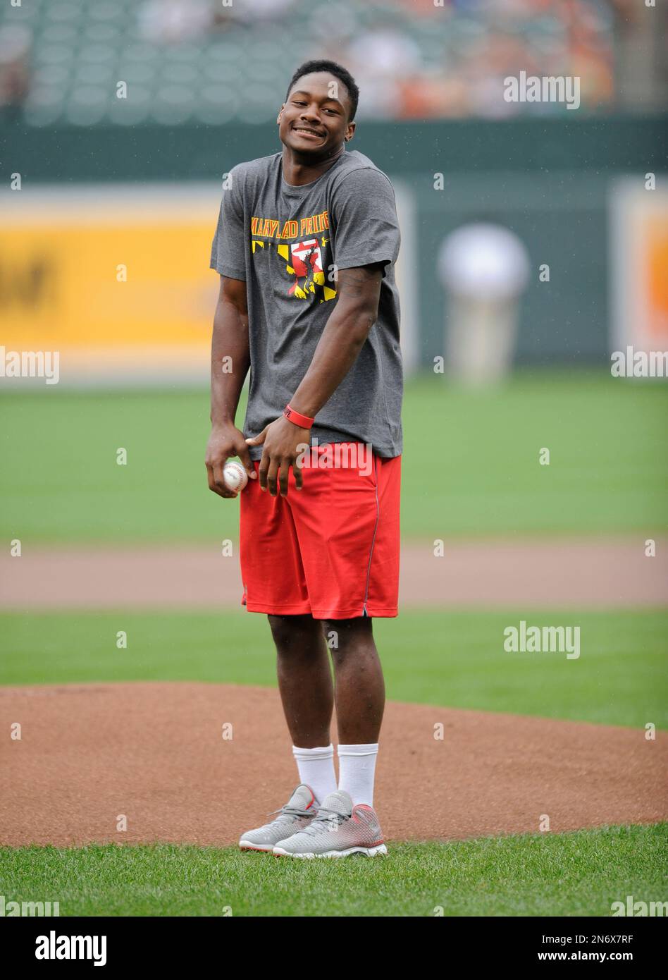 Maryland football player Stefon Diggs reacts before throwing out the ...