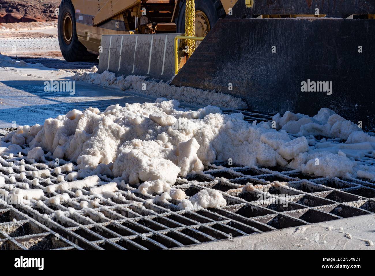 Potash left on the metal grate over a slurry pit after being dumped ...